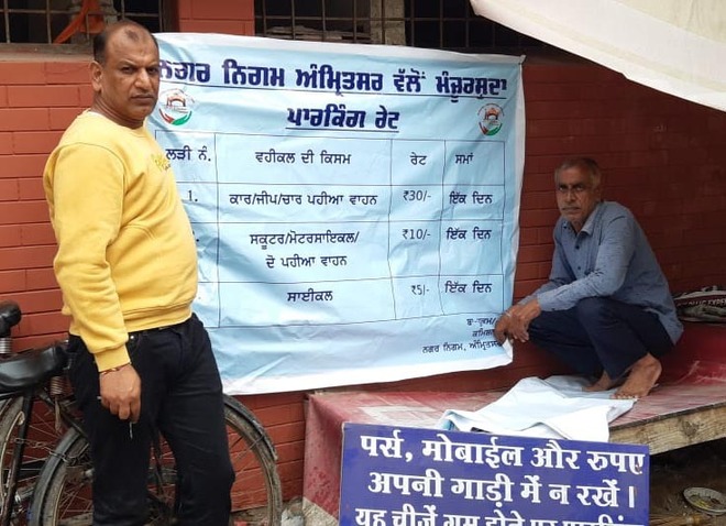 MC displays rate list at parking lots - The Tribune