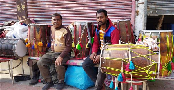 Covid restrictions deal a blow to dholis - The Tribune