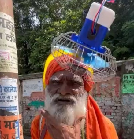 'IITian Baba': Old man mounts fan, solar panel over head to evade heat ...