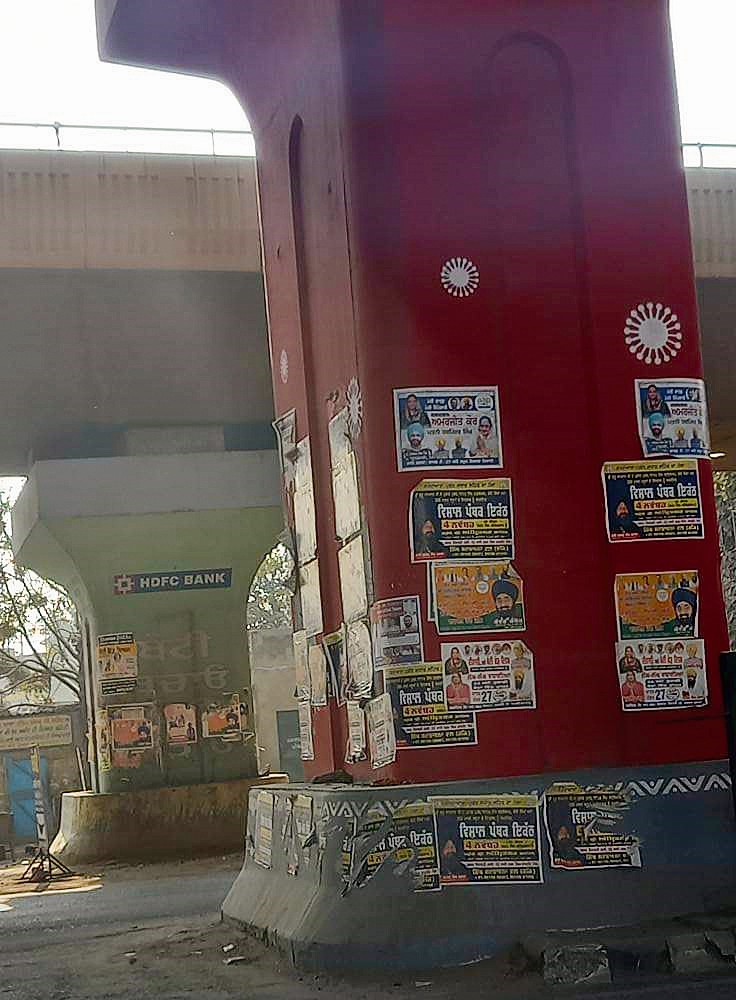 Posters deface paintings on pillars - The Tribune