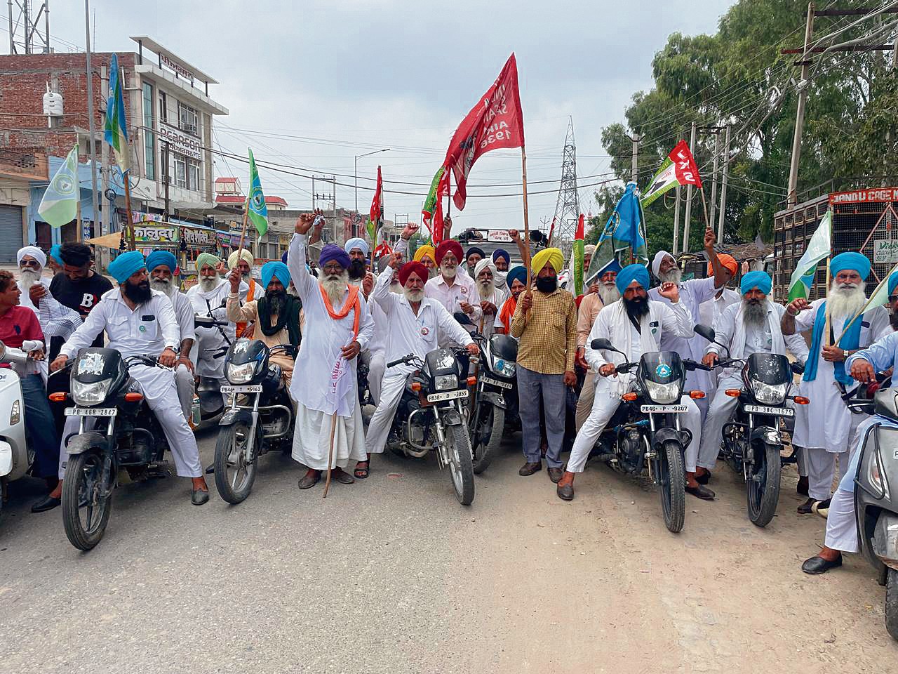 Farmers hold motorcycle march in Bhikhiwind - The Tribune